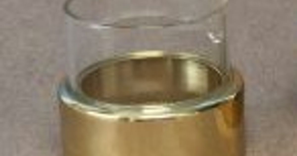Brass flame protector for candle shells